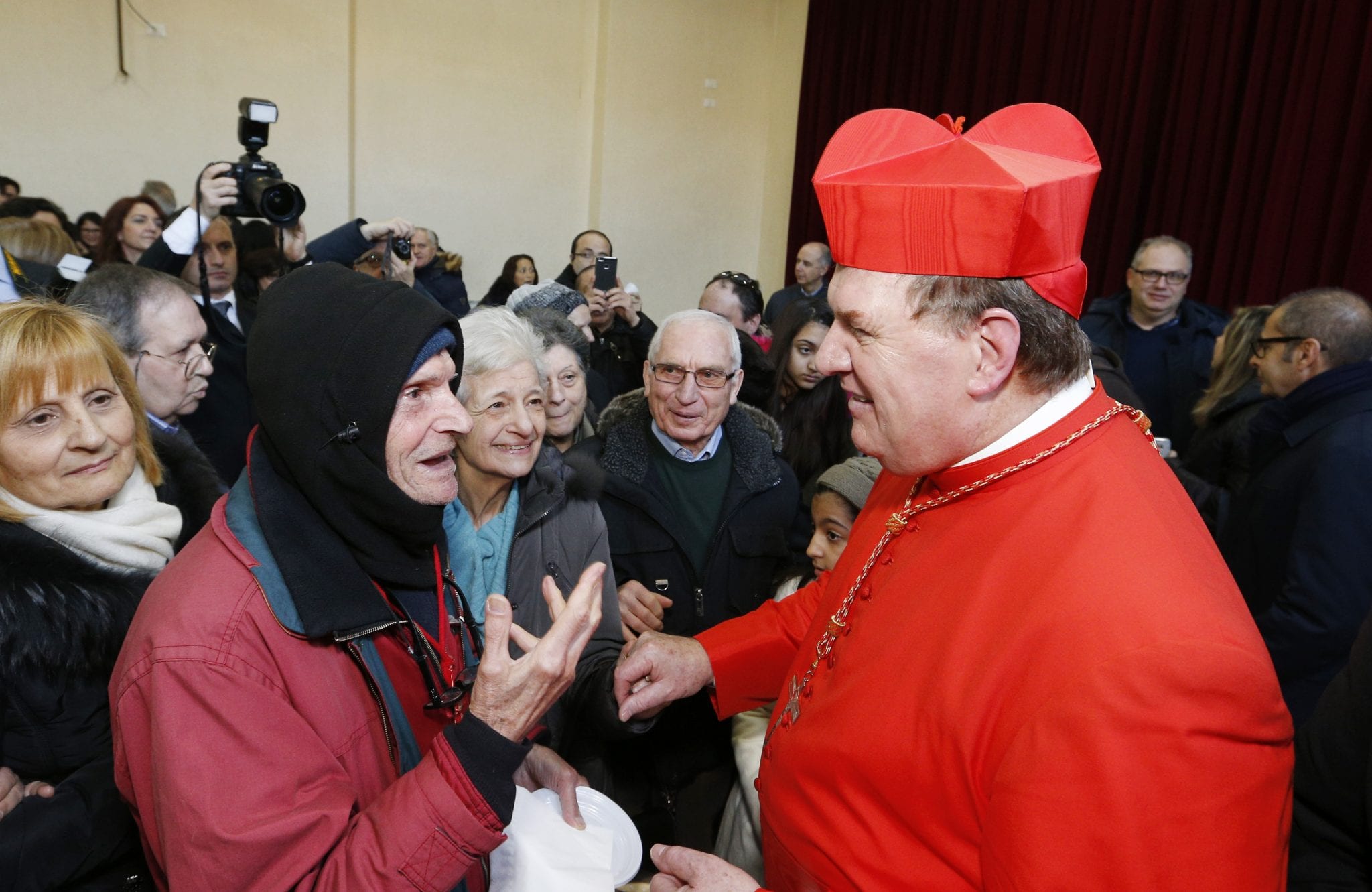 Surrounded by ‘family,’ U.S. cardinal takes possession of titular ...