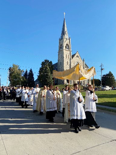 Eucharistic procession makes history crossing river from Iowa to ...